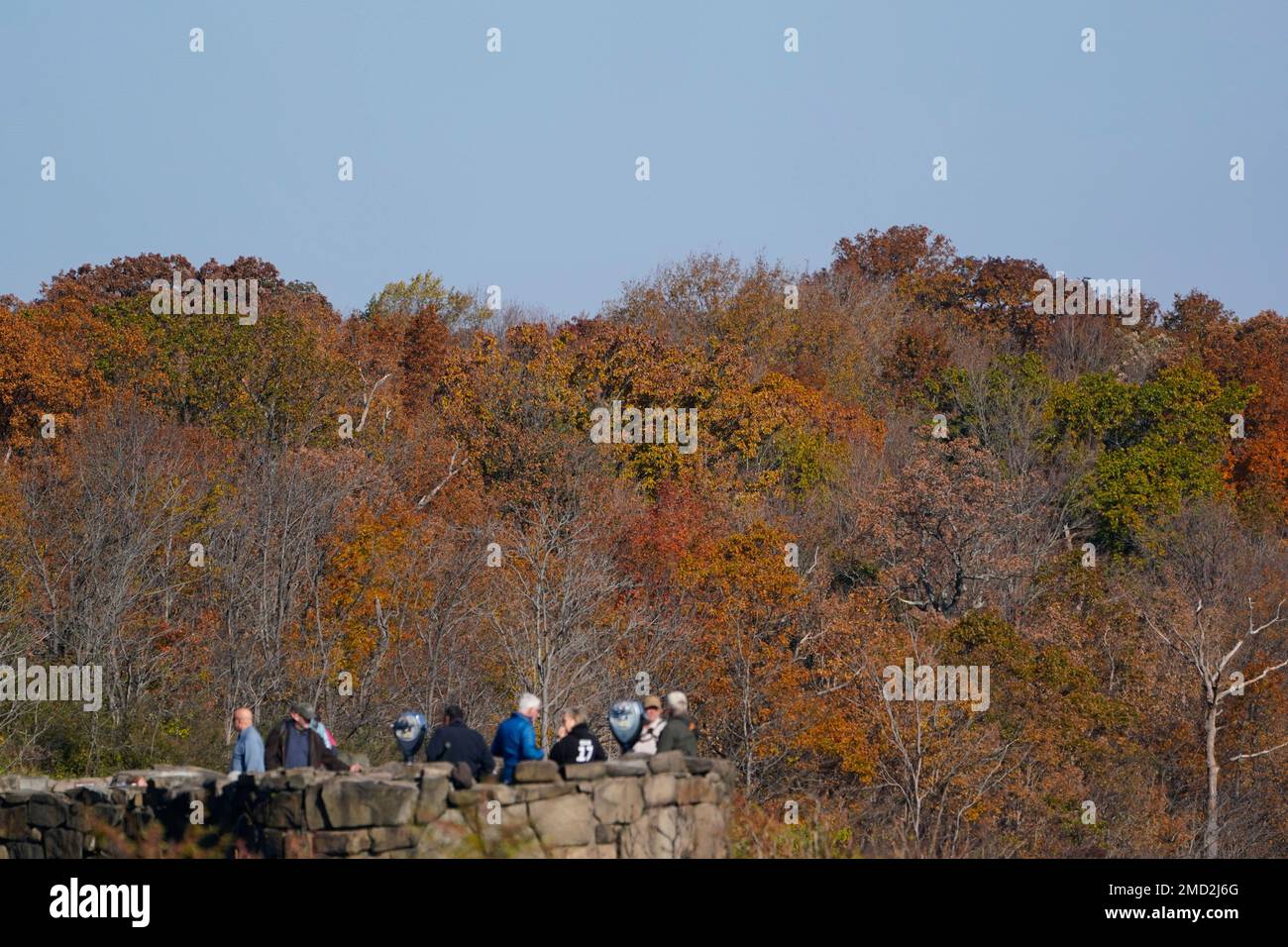 People enjoy the view and fall colors of the Palisades from a scenic ...