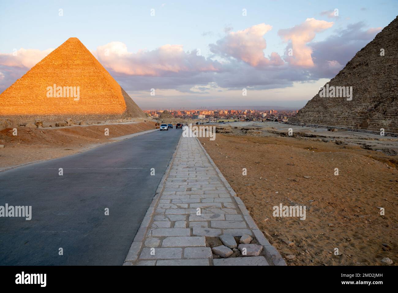 Top part of the highest Giza pyramid of Khufu or Cheops and Cairo city ...