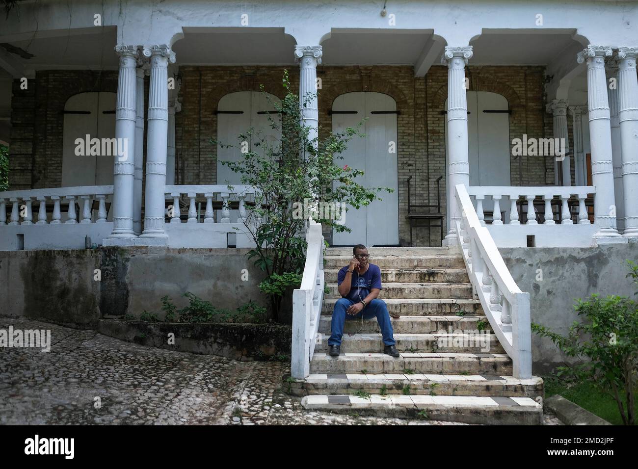 Catholic priest Jean-Nicaisse Milien speaks during a phone interview ...