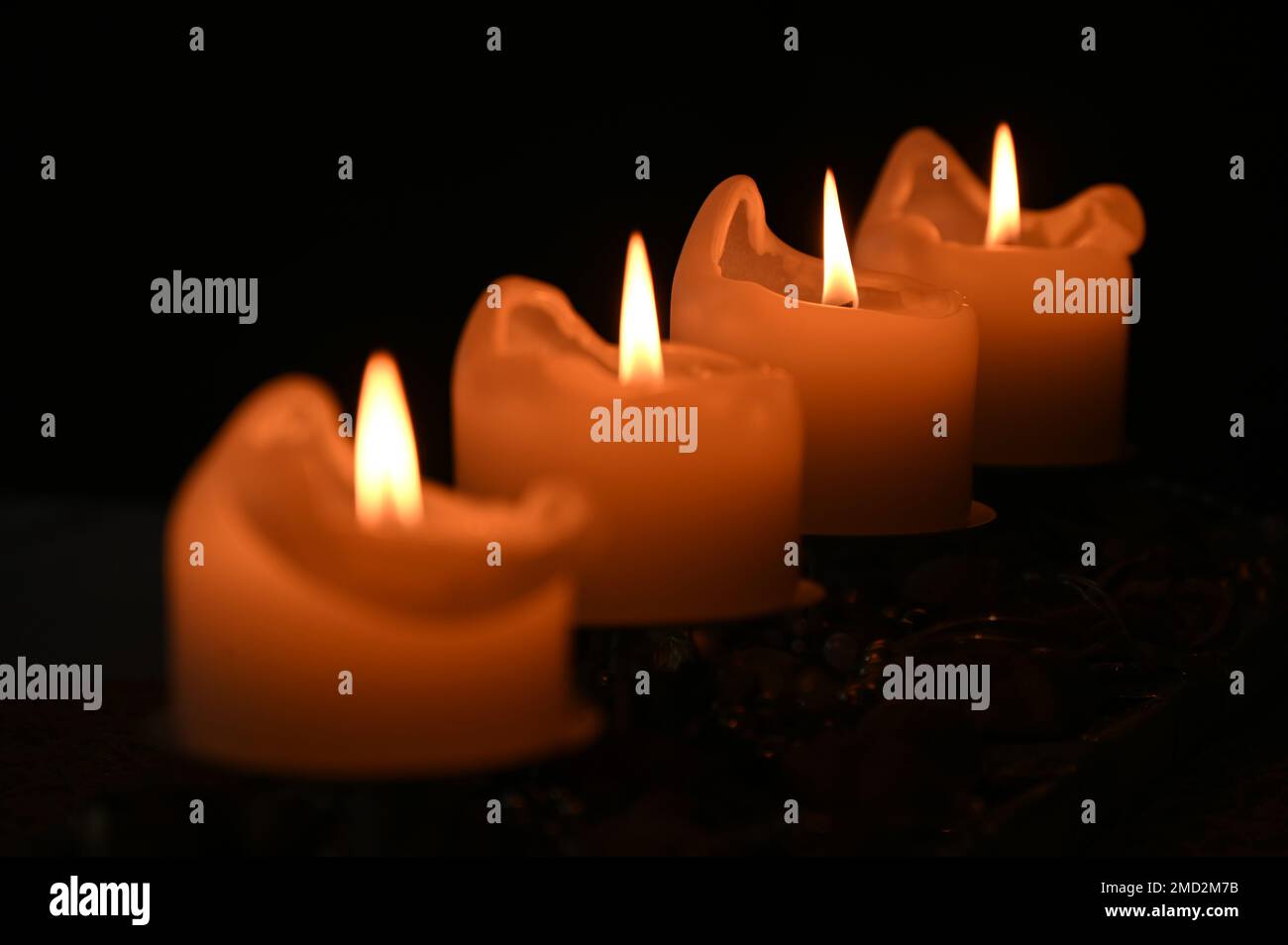 4 lit candles hi-res stock photography and images - Alamy