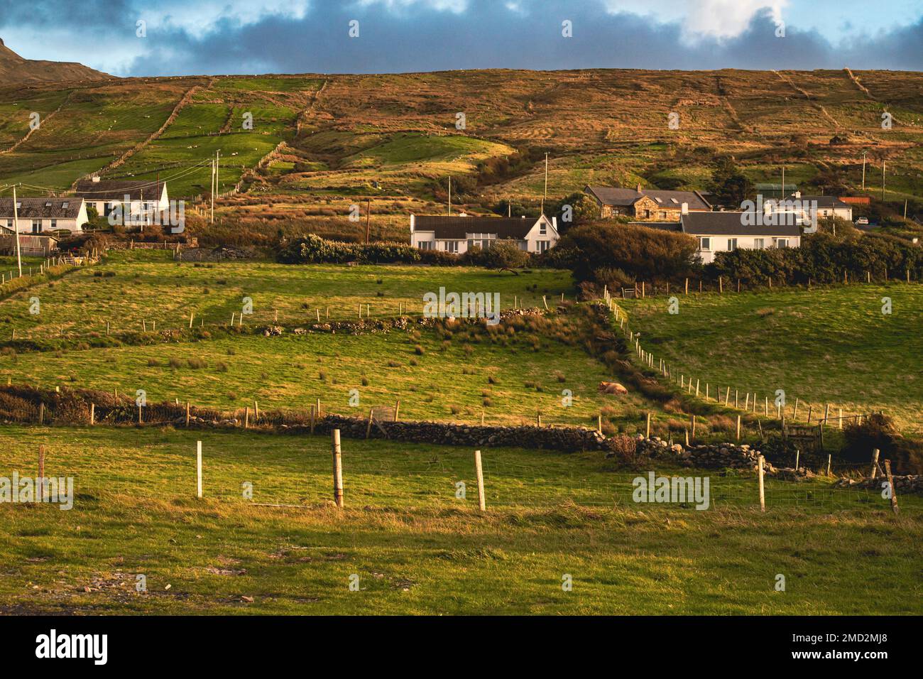 Irish village, mountains and pastures Stock Photo - Alamy