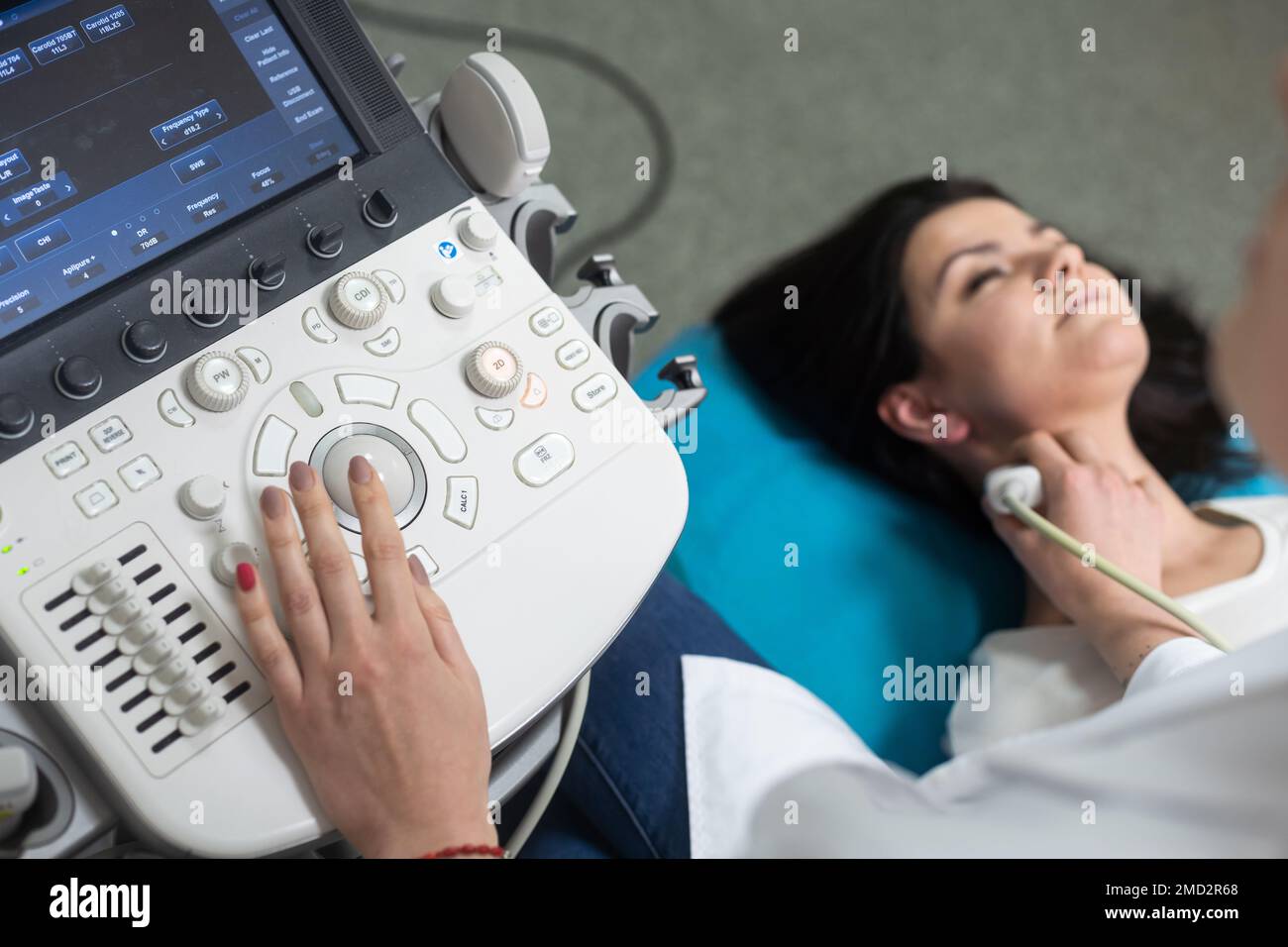 Ultrasound scanning diagnostic of woman thyroid gland in clinic, doctor ...
