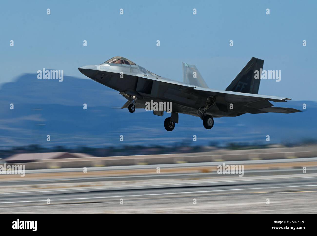 An F-22 Raptor from the 1st Fighter Wing takes off at Nellis Air Force ...