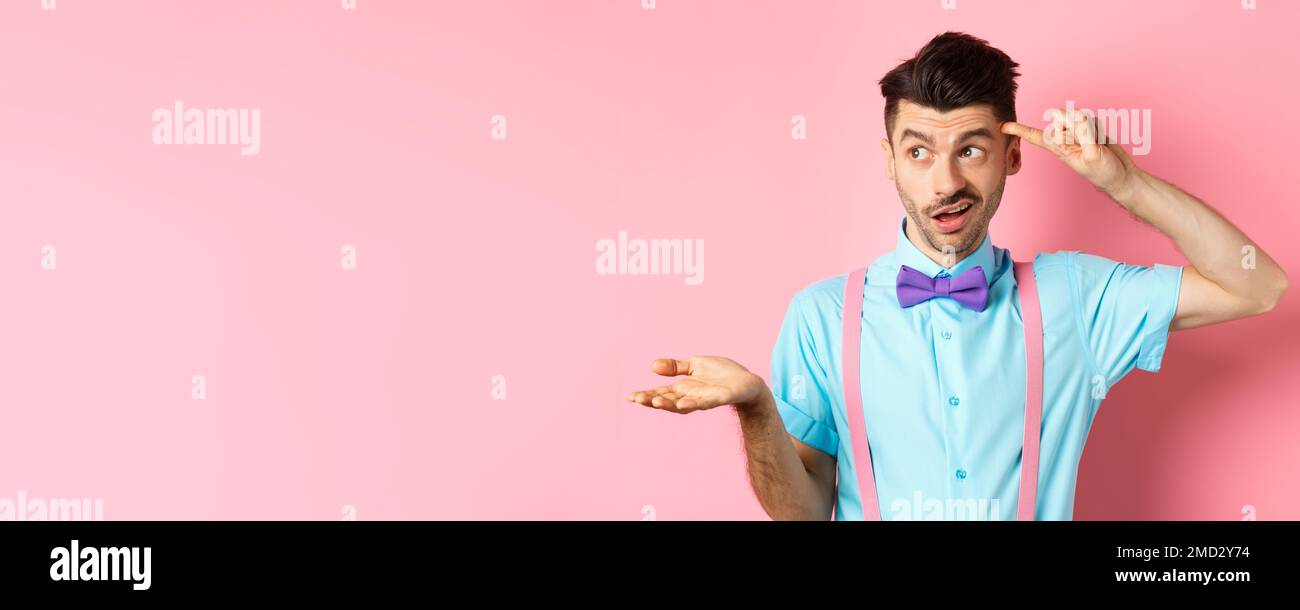 Annoyed and skeptical guy complain on something stupid, pointing finger ...