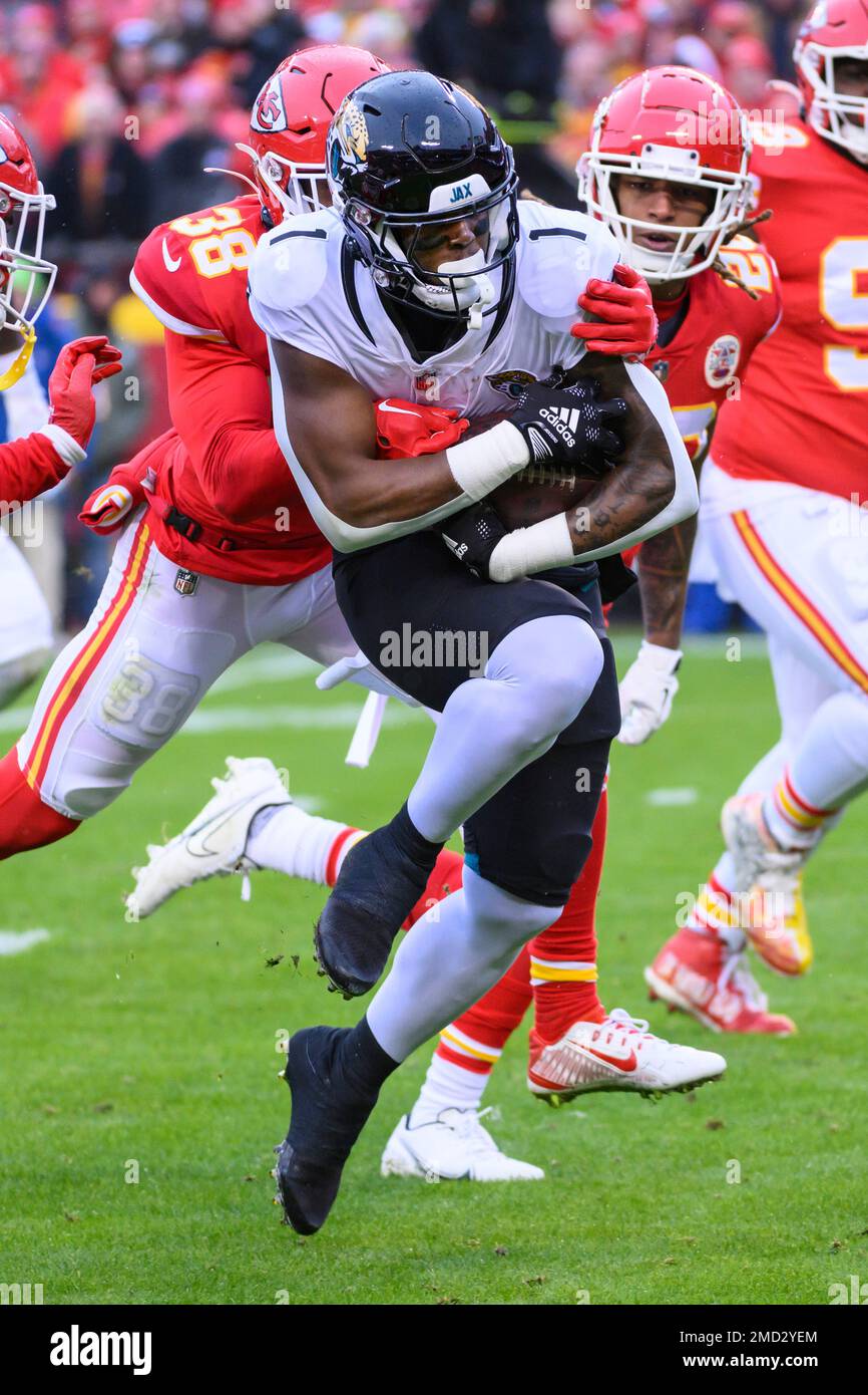 Jacksonville Jaguars running back Travis Etienne Jr. (1) is tackled by ...