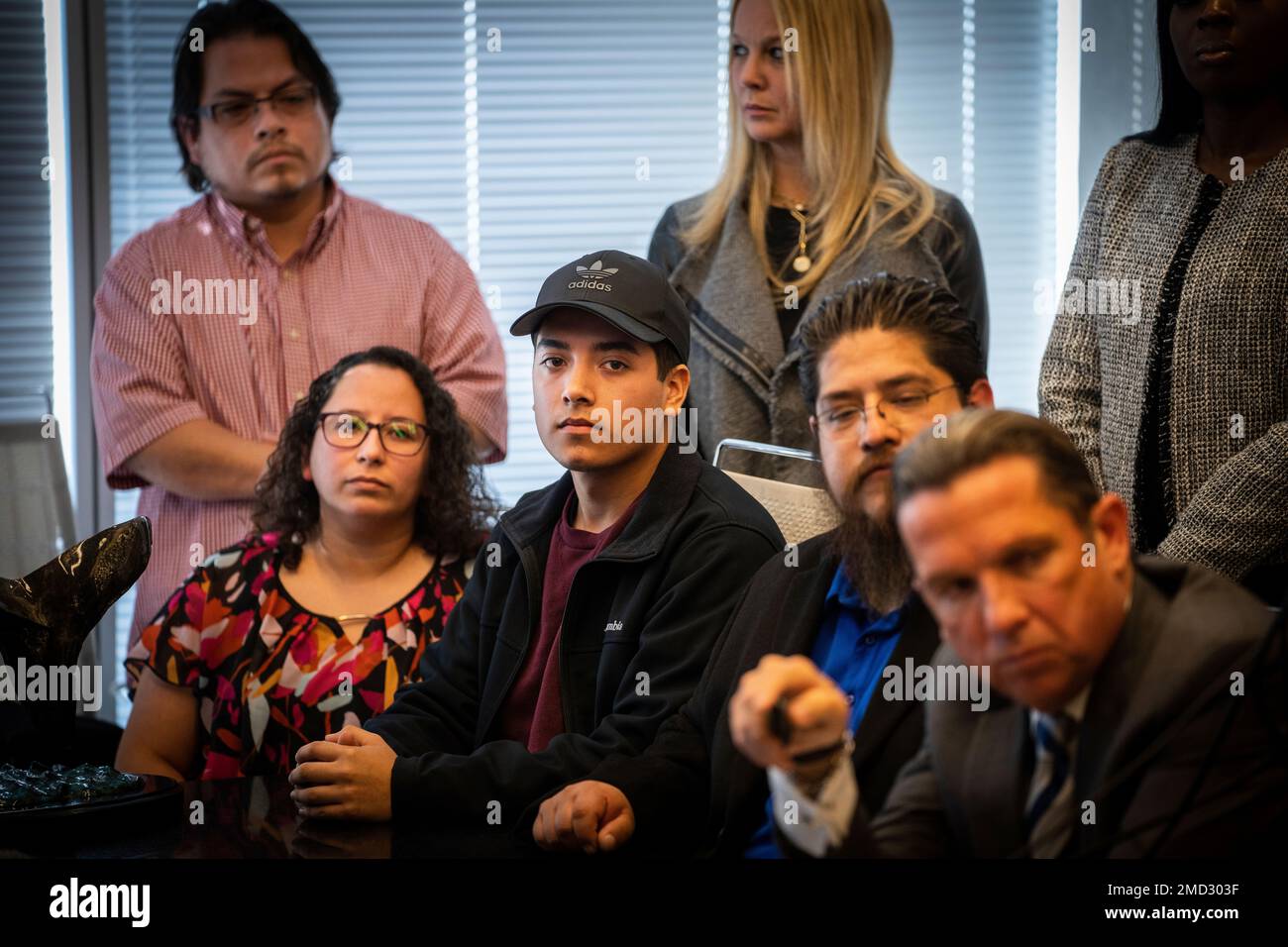 Joel Acosta, brother of Axel Acosta, looks into the camera at a news ...