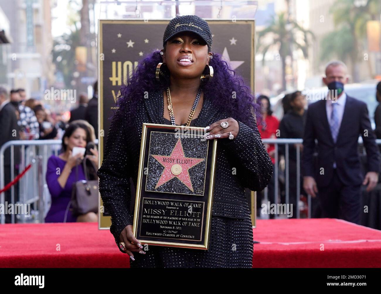 Hip hop artist Missy Elliott holds a replica of her new star on the ...