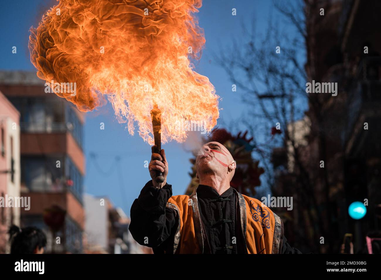A man performs fire stunts during the Chinese New Year festival on ...