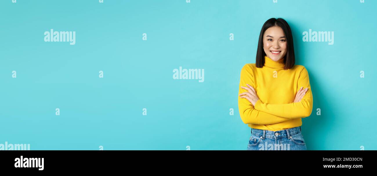 Confident and stylish asian woman cross arms on chest and smiling ...