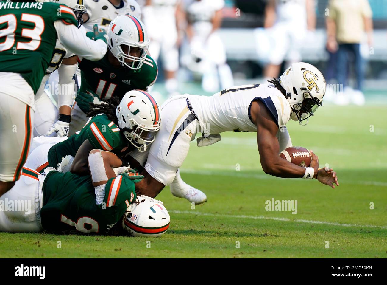 Georgia Tech quarterback Jeff Sims, right, is taken down after running ...