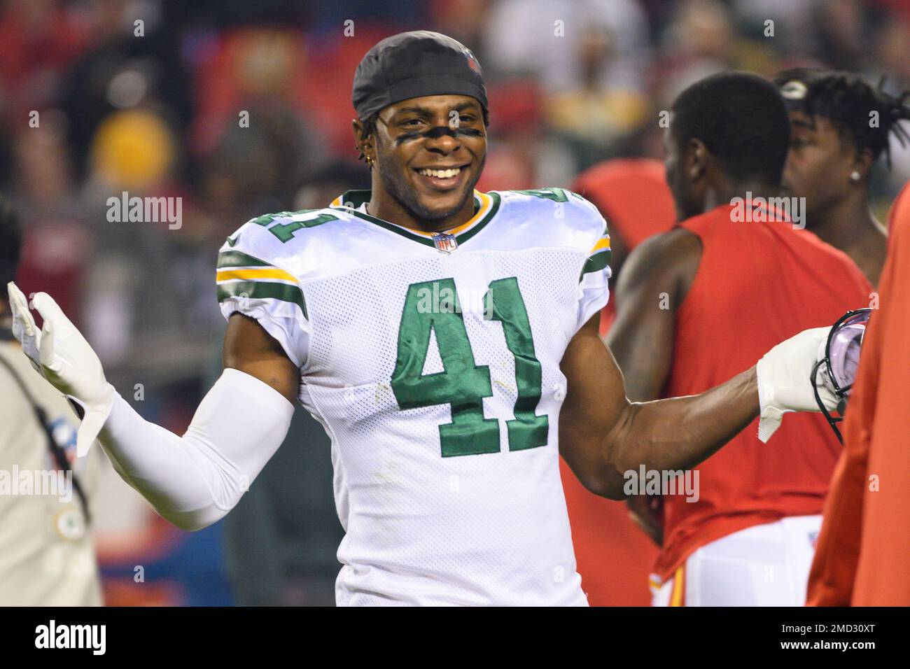 Green Bay Packers safety Henry Black greets a member of the Kansas City ...