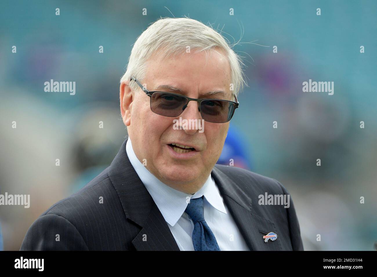 Buffalo Bills owner Terry Pegula watches players warm up before an NFL ...