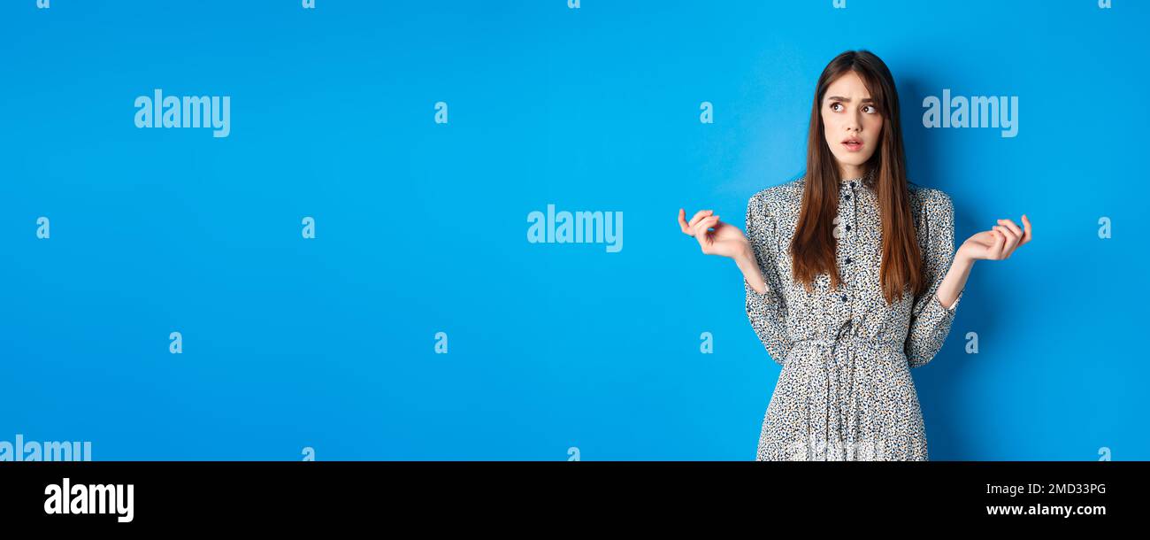 Confused cute girl cant understand something, look away pensive and ...