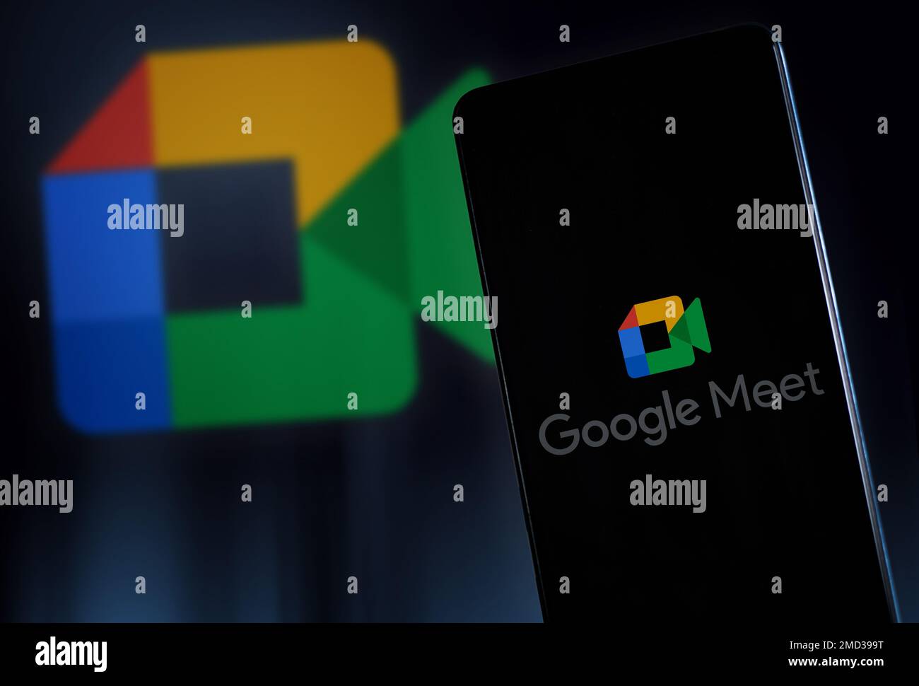 Google Meet logo on smartphone display and background. Milan Italy ...