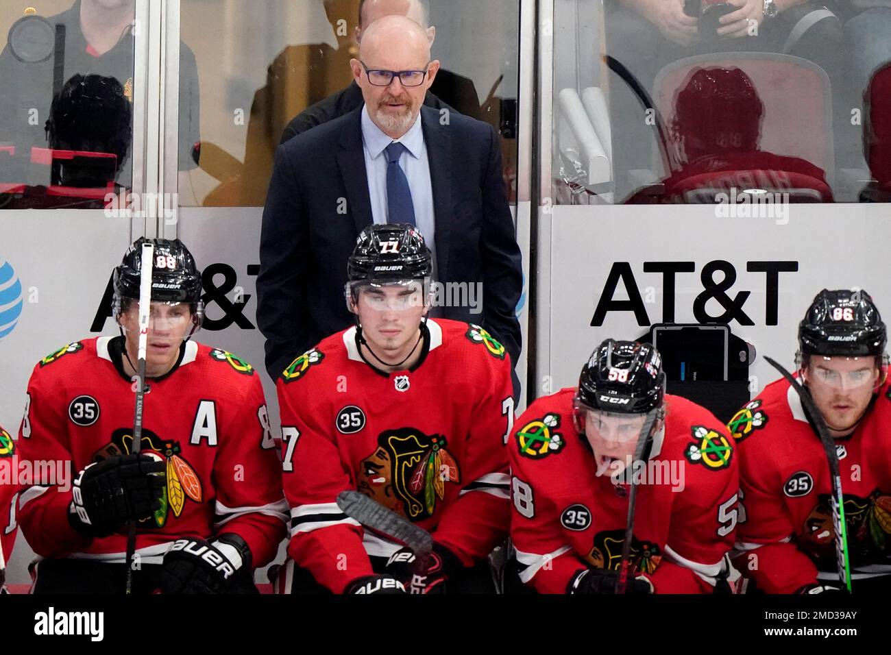 Chicago Blackhawks interim head coach Derek King, top, watches his team ...
