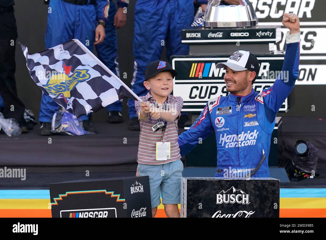 Kyle Larson, right, and his son Owen celebrate after winning a NASCAR ...