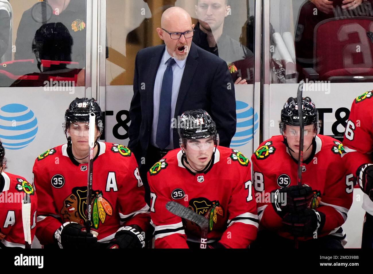 Chicago Blackhawks interim head coach Derek King, top, yells his team ...