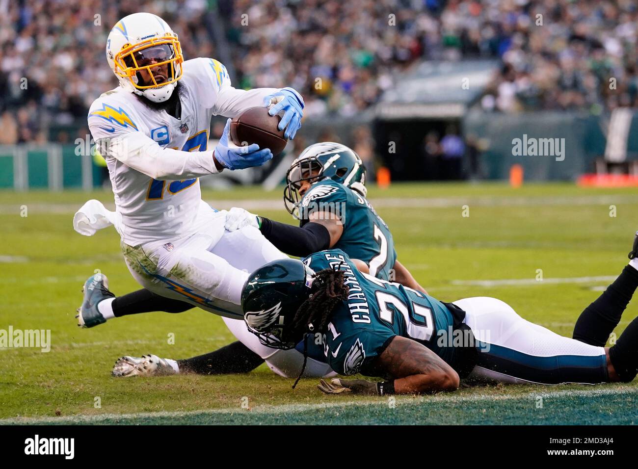 Los Angeles Chargers wide receiver Keenan Allen (13) is brought down ...