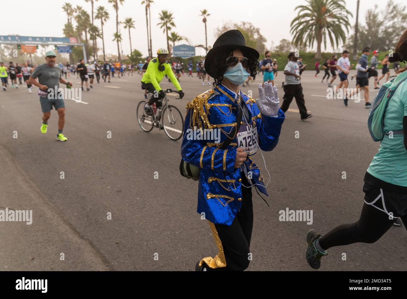 A runner dressed as entertainer Michael Jackson joins thousands of ...