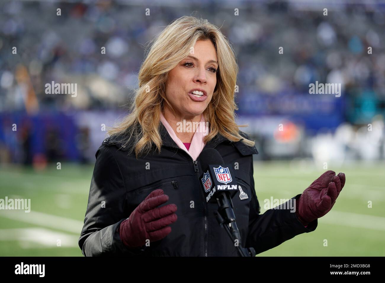 NFL Network reporter Kim Jones works on the sideline before an NFL ...
