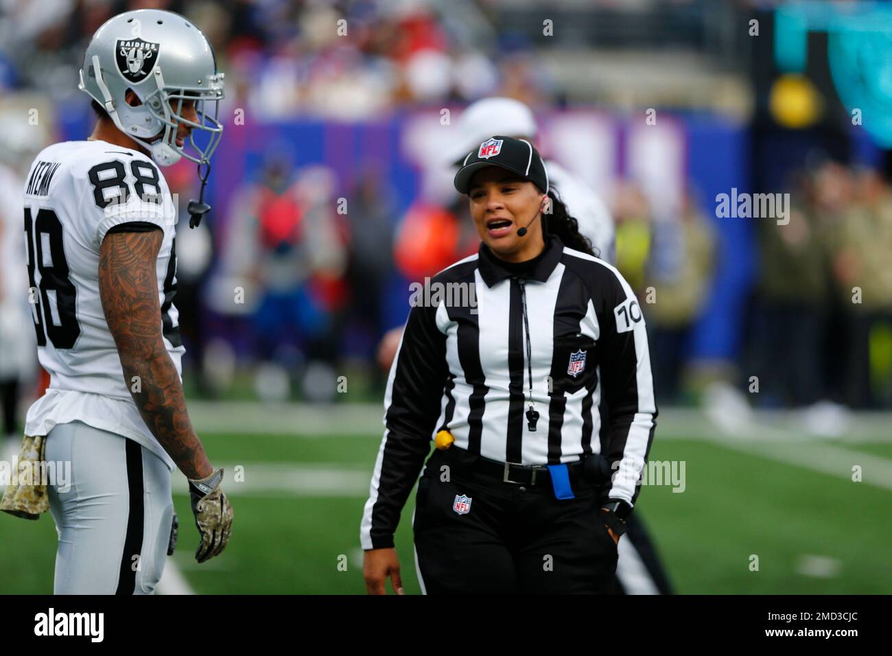 Las Vegas Raiders' Marcell Ateman (88) talks to line judge Maia Chaka ...