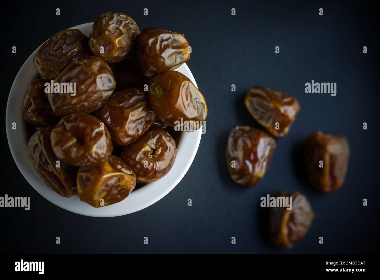 fresh dates on white bowl, healthy food black background Stock Photo ...