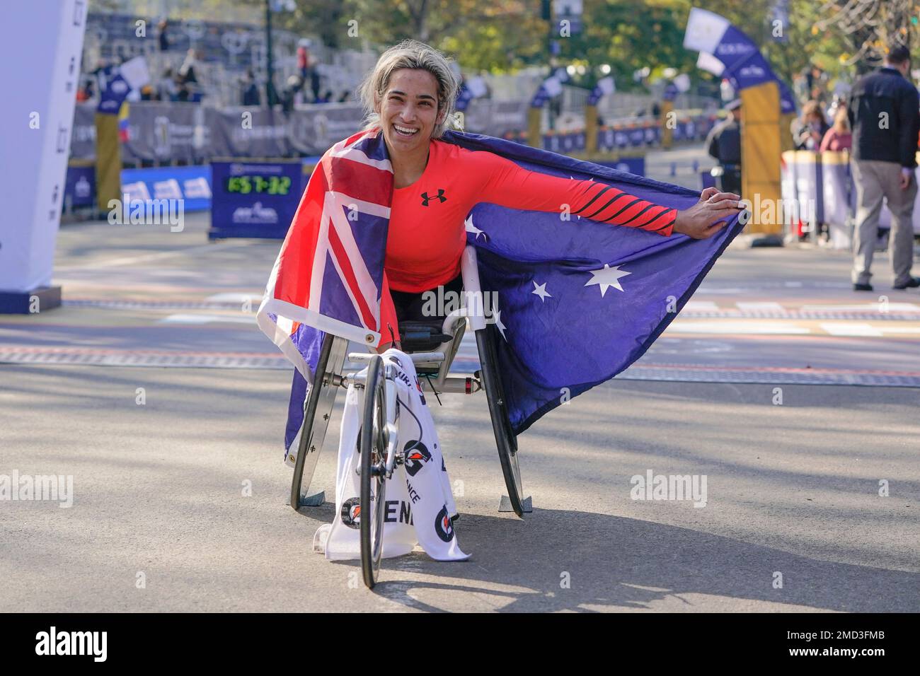 Madison de Rozario of Australia poses for a picture after crossing the ...