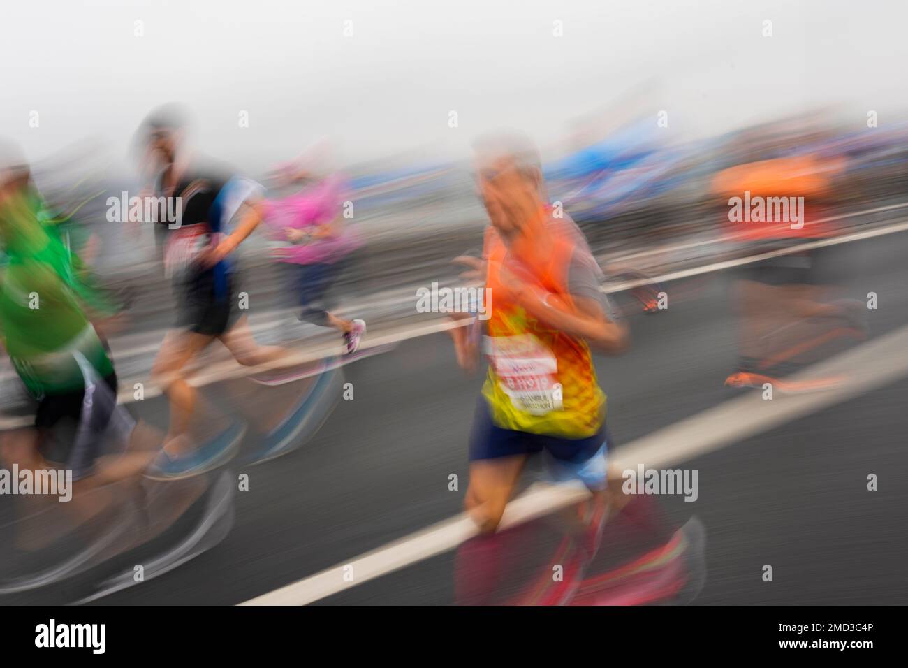 Runners cross the 15th July Martyrs bridge over the Bosphorus during ...
