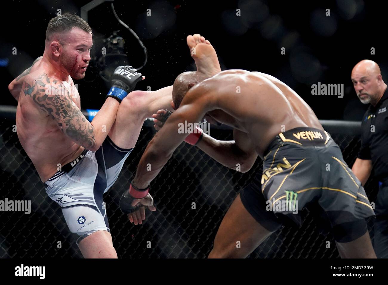 Colby Covington throws a kick against Kamaru Usman during a ...