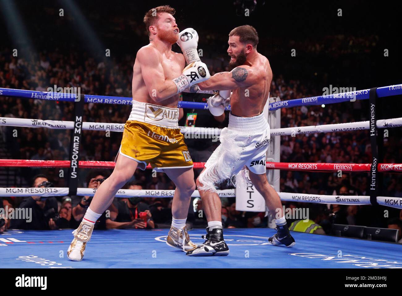 Caleb Plant hits Canelo Alvarez, of Mexico, during a super middleweight ...