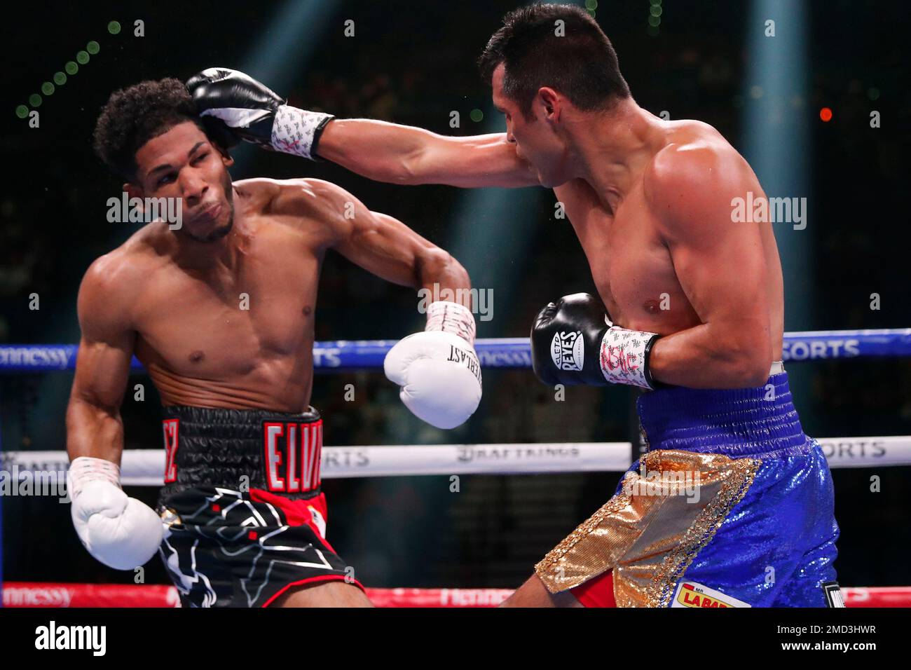Juan Pablo Romero, of Mexico, hits Elvis Rodriguez, of the Dominican ...