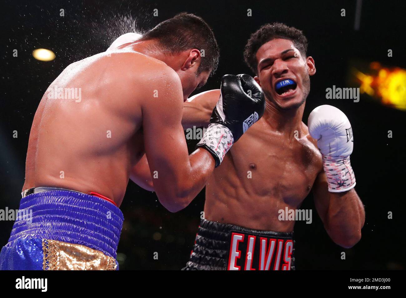 Elvis Rodriguez, of the Dominican Republic, hits Juan Pablo Romero, of ...