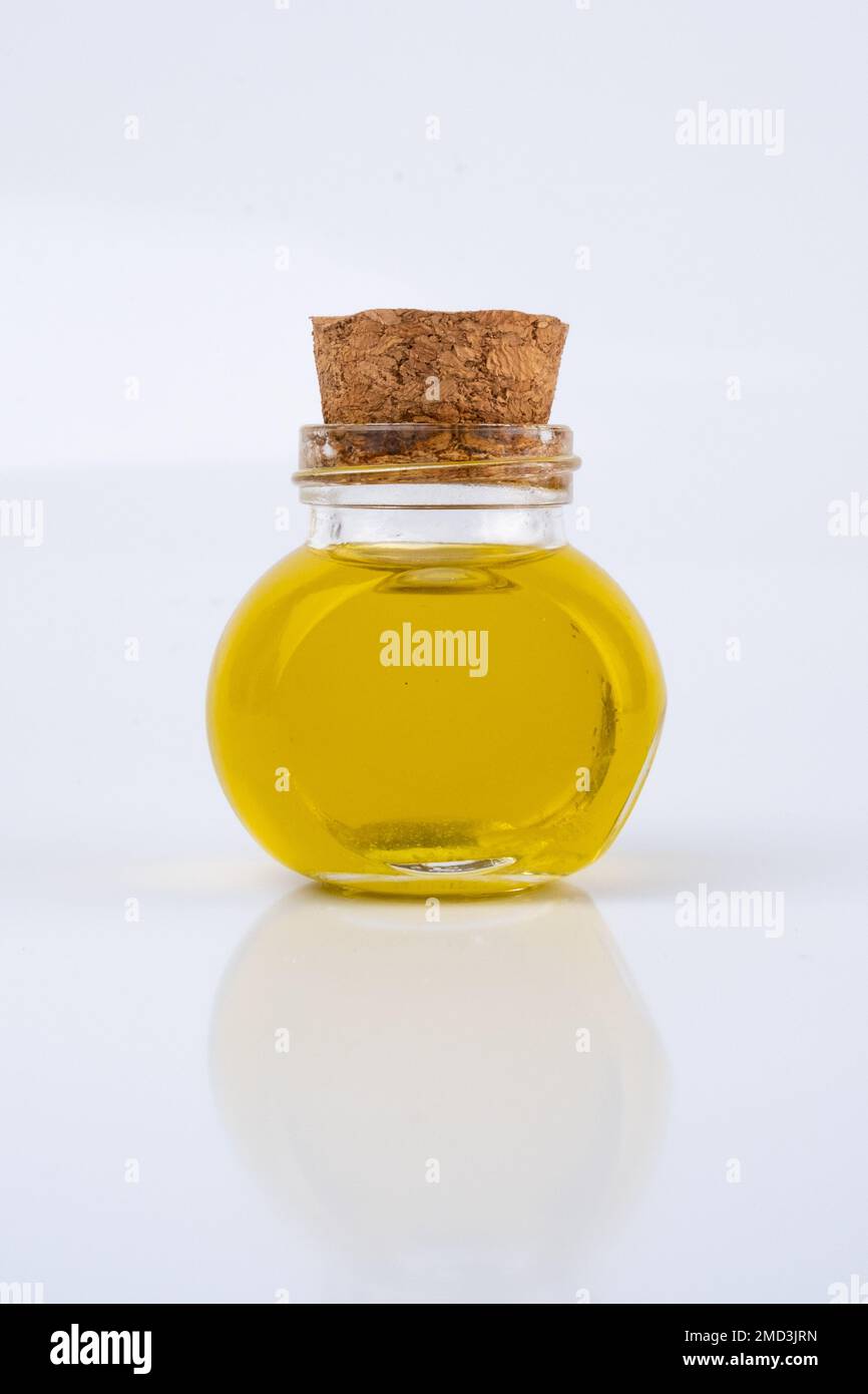 Small Oil Bottle Isolated On White Background. Wellow Liquid In A Small ...
