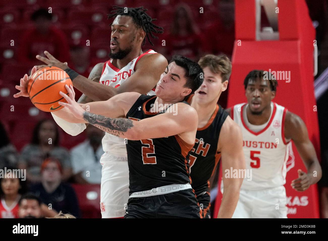 Montana Tech guard Camdyn LaRance (2) and Houston forward J'Wan Roberts ...