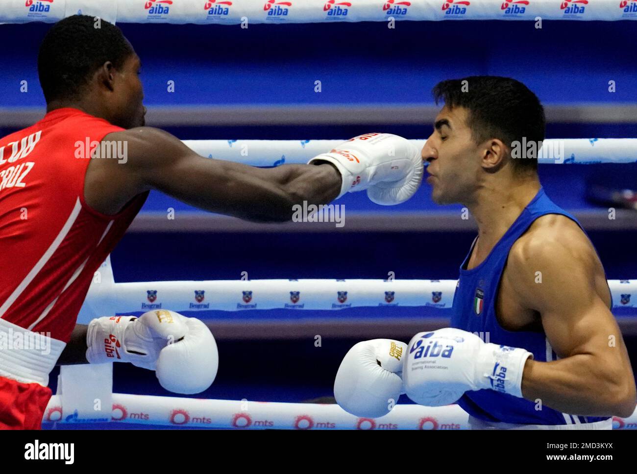Cuba's Julio La Cruz Peraza, left, fights with Italy's Aziz Abbes ...