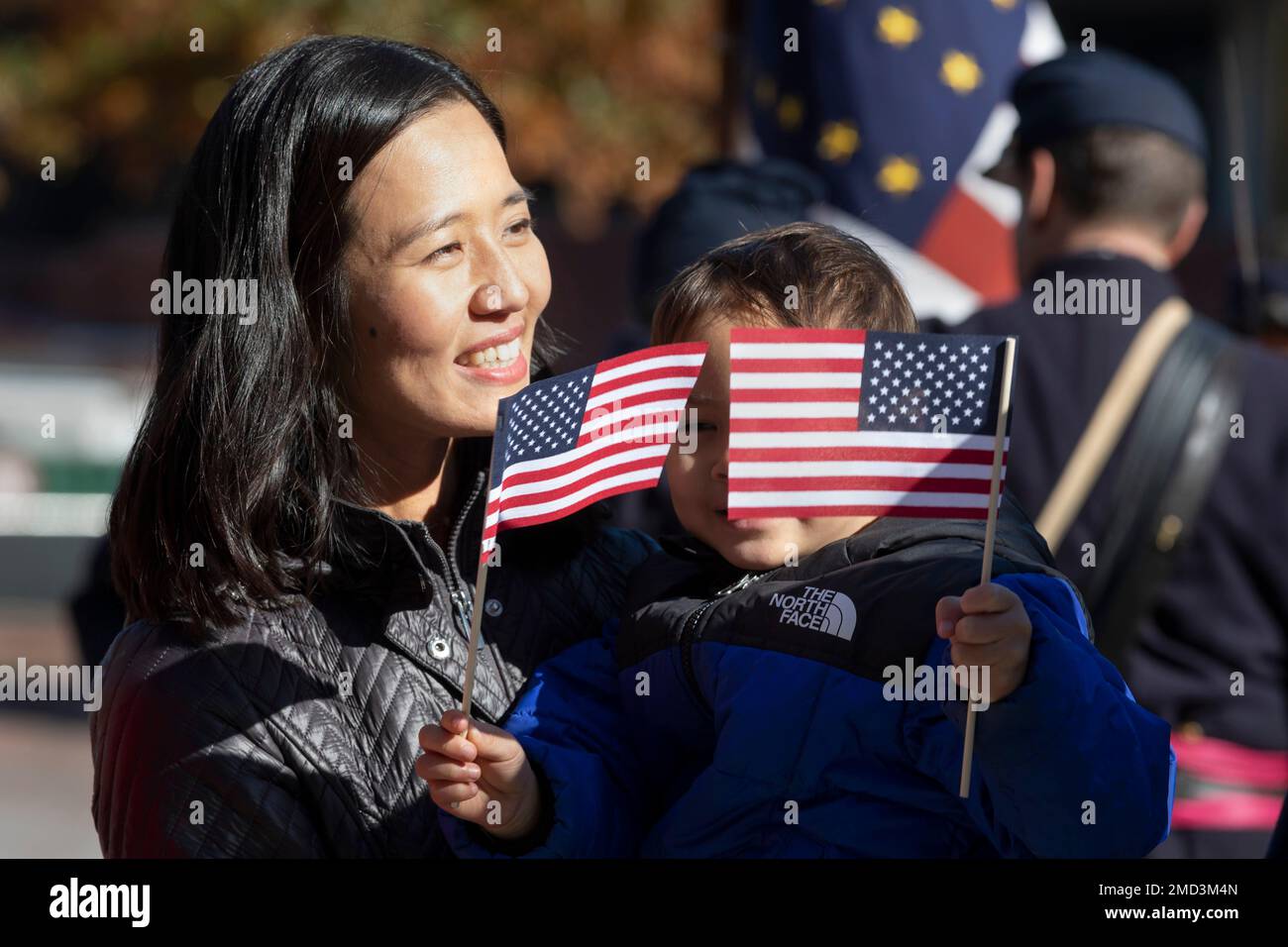 Boston Mayor-elect Michelle Wu stands with her son Cass after walking ...