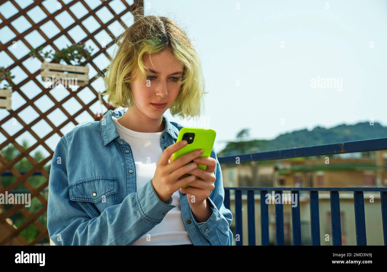 Girl with a phone. Social media addiction concept Stock Photo - Alamy