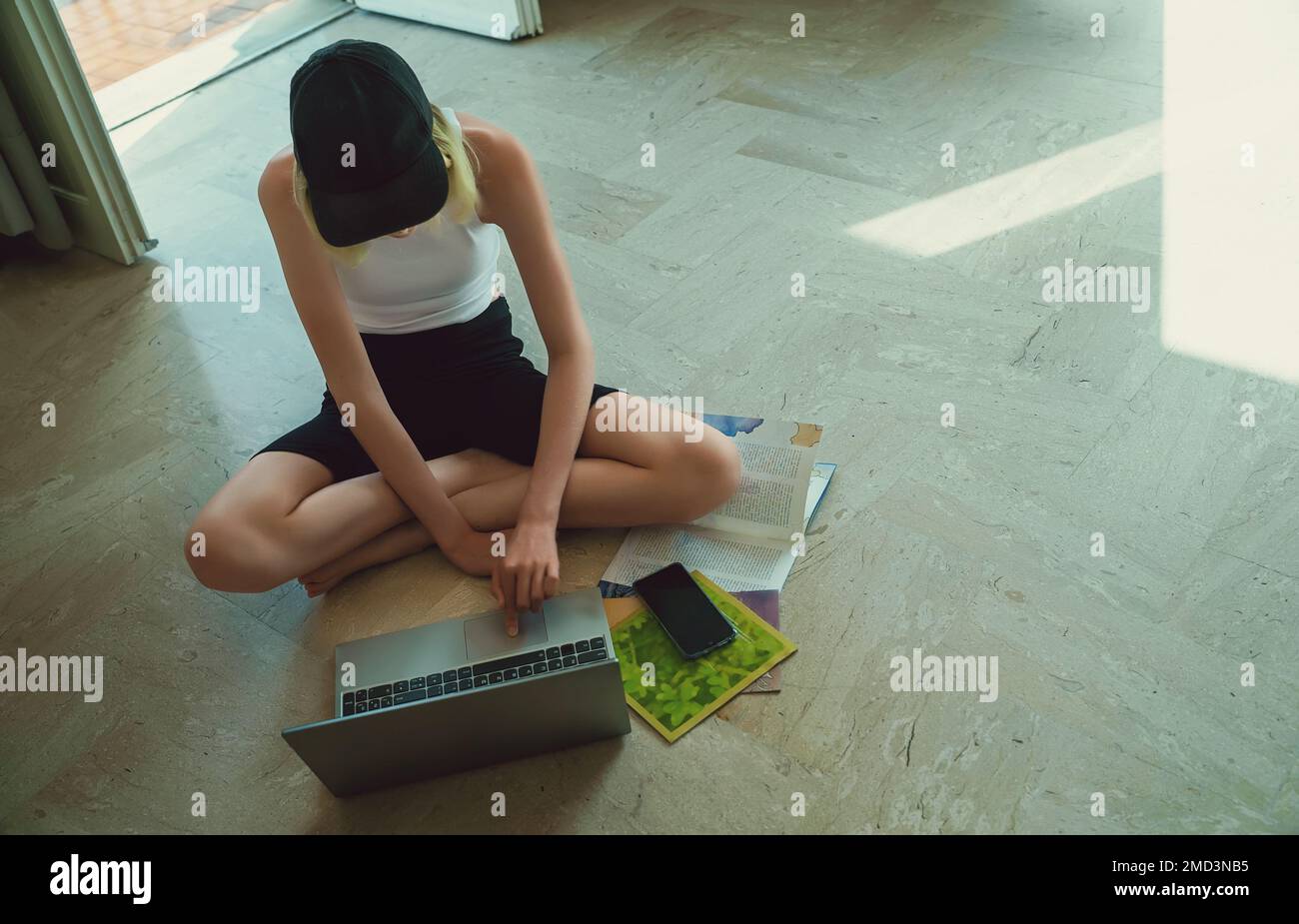 Teenage girl doing her homework with laptop Stock Photo - Alamy