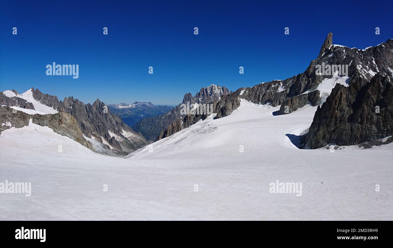 A beautiful view of the snowy mountains on a sunny day Stock Photo - Alamy