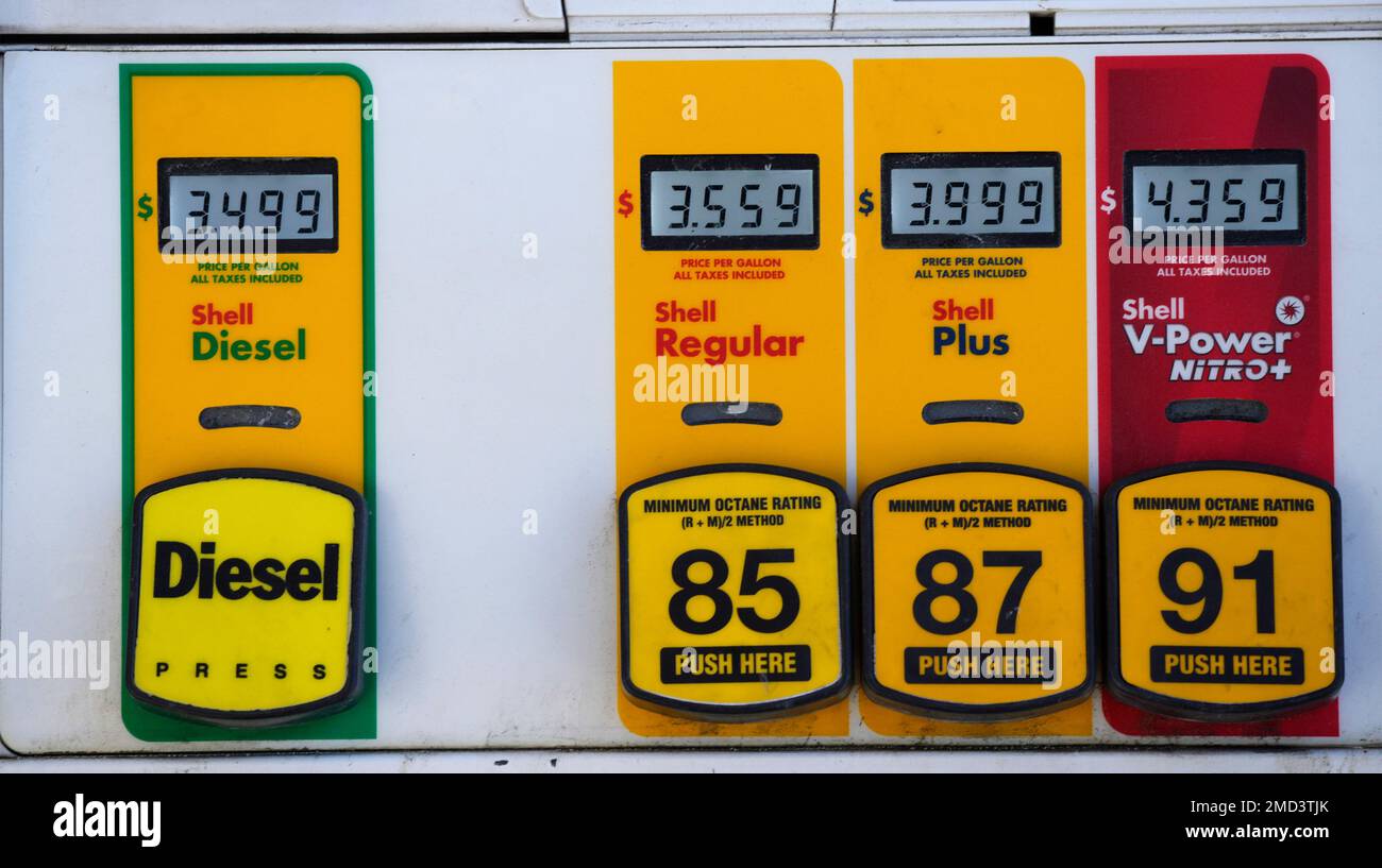 The per-gallon prices are illuminated above the various grades of ...
