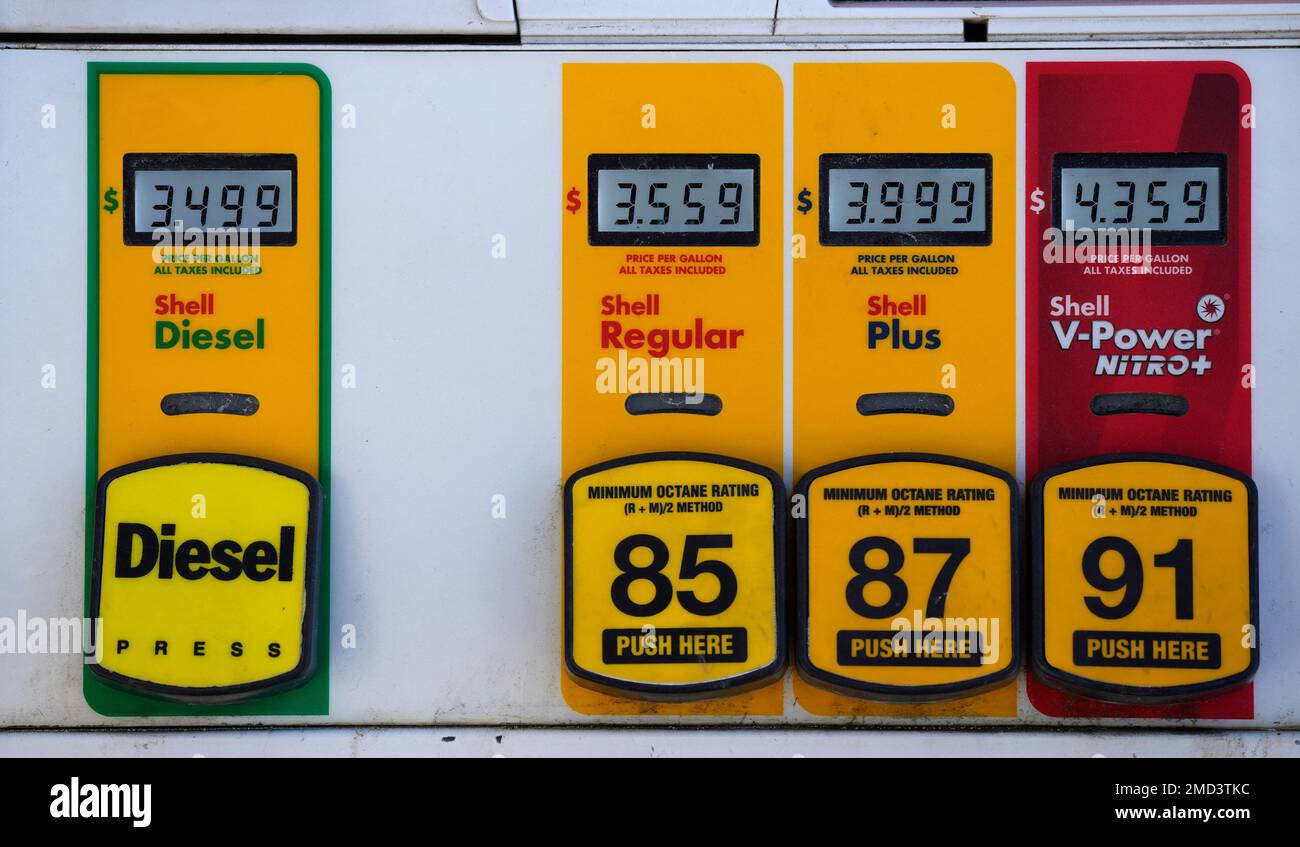The per-gallon prices are illuminated above the various grades of ...