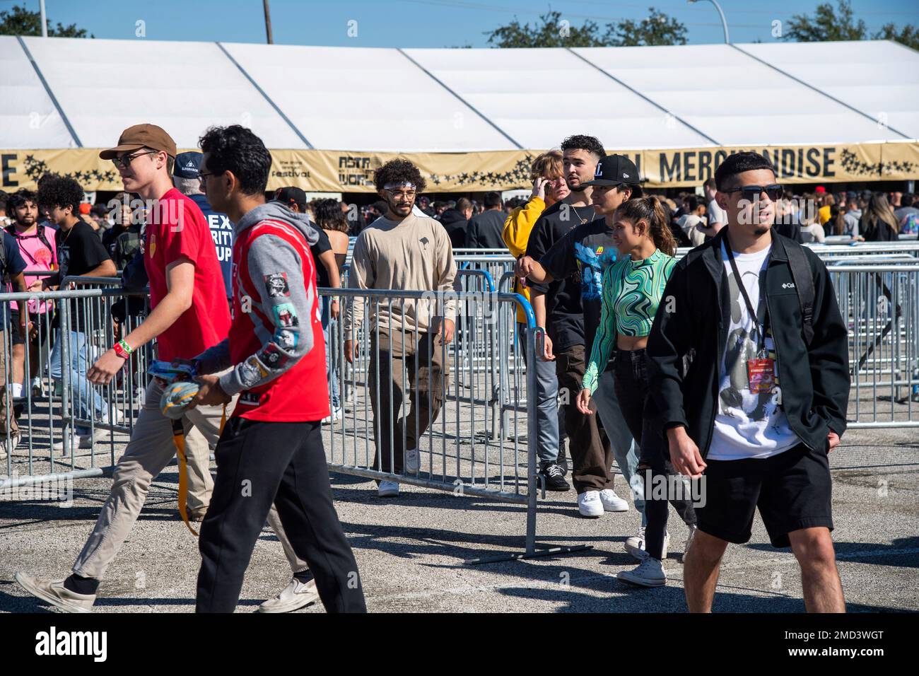 Festival goers are seen at the Astroworld Merchandise area on day one ...
