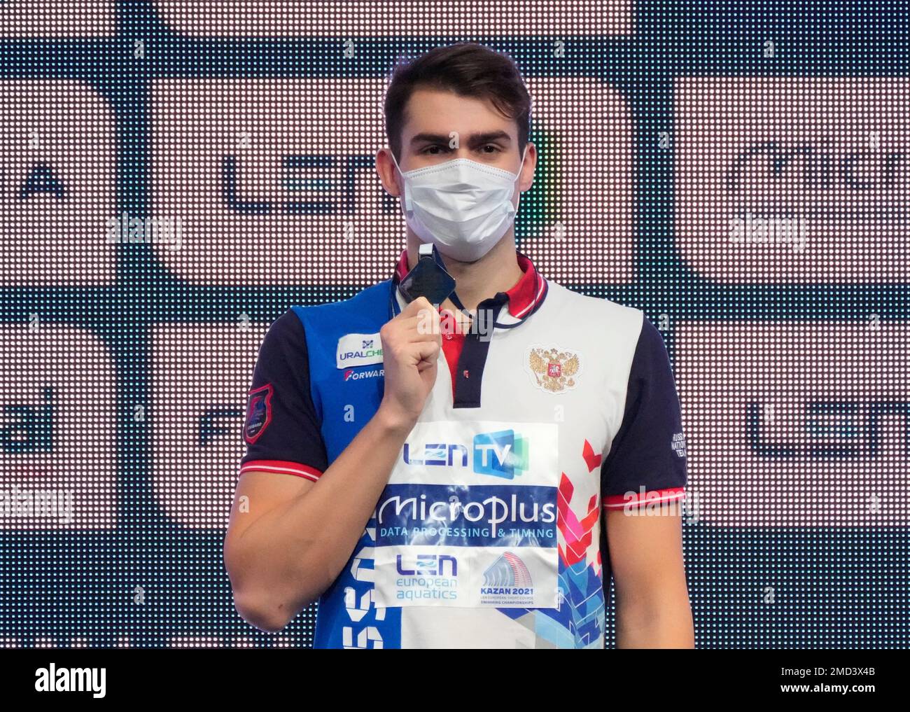 Winner Kliment Kolesnikov of Russia poses during a medal ceremony after the Men's 100m ...