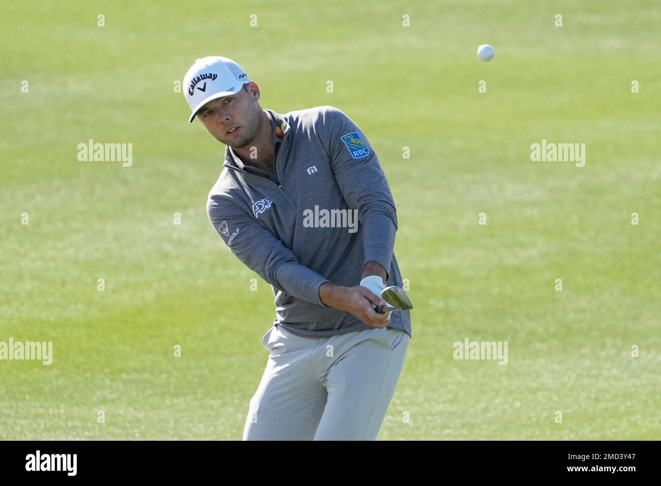 Sam Burns chips to the first hole during the final round of the ...