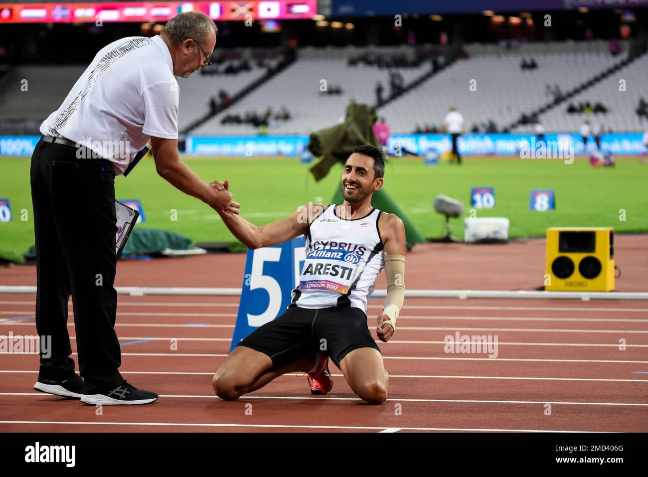 Andonis Aresti being helped up by an official after winning bronze in ...