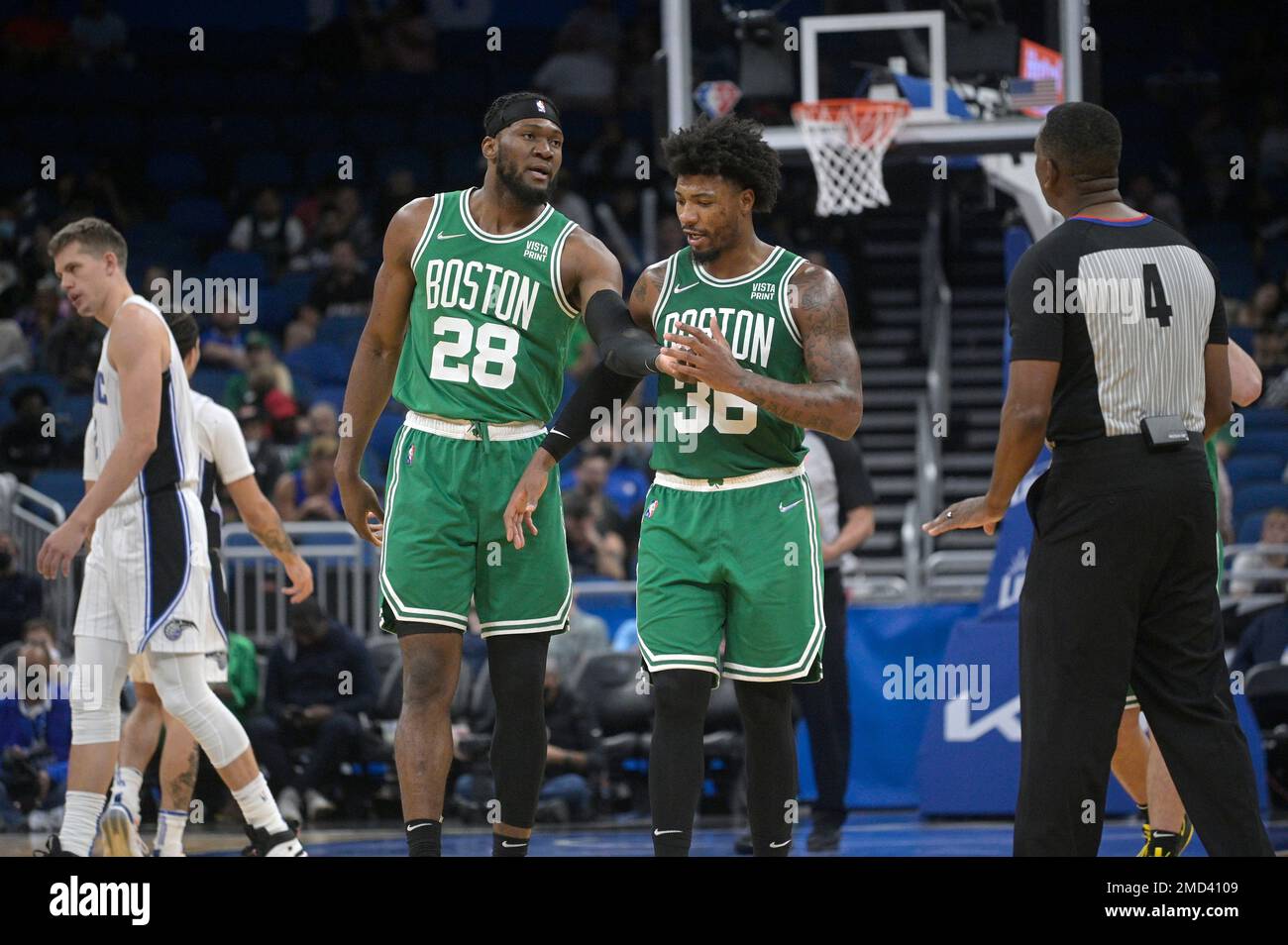 Boston Celtics center Bruno Fernando (28) talks with guard Marcus Smart ...