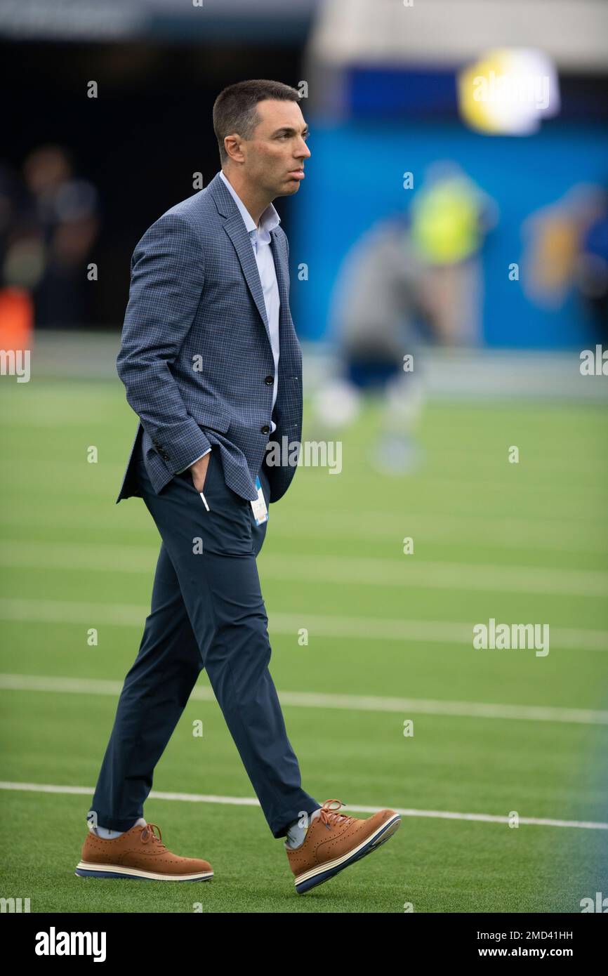 Los Angeles Chargers general manager Tom Telesco talks on the field ...