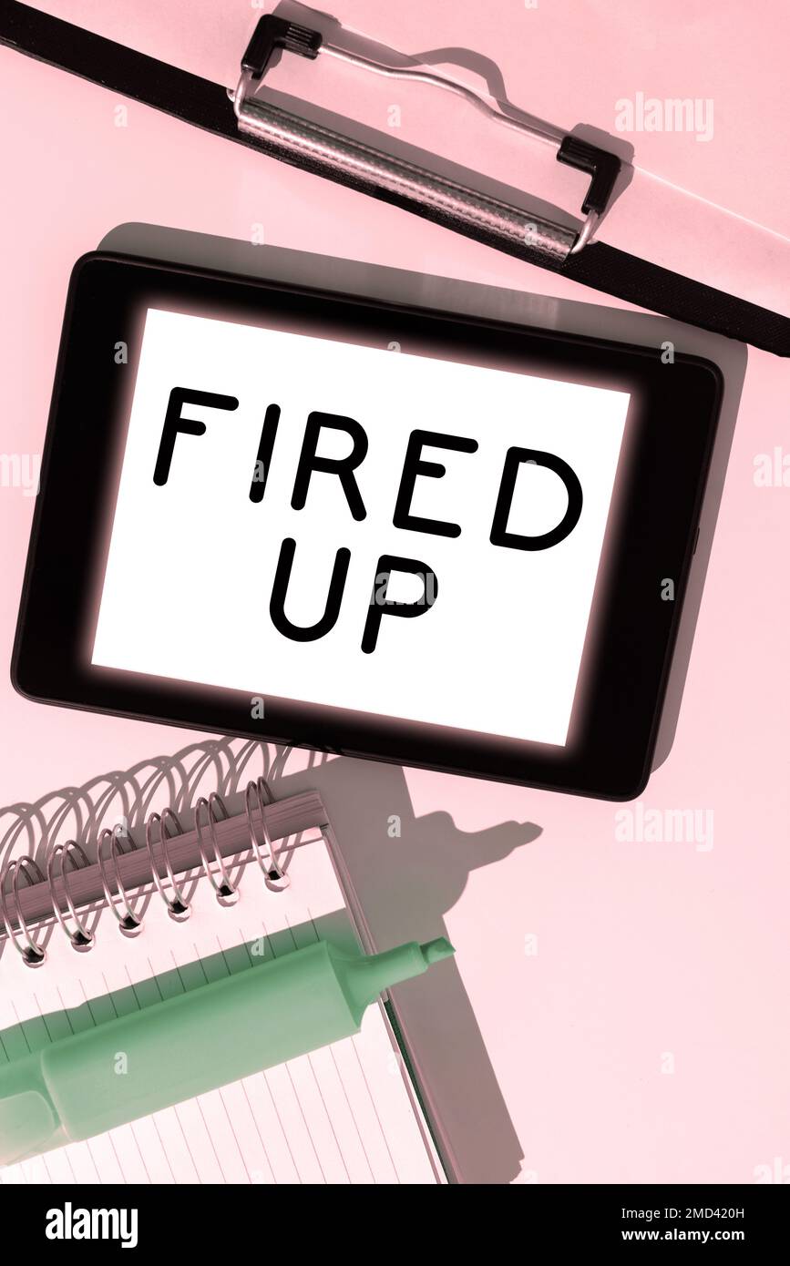 Hand writing sign Fired Up. Concept meaning means that someone ...