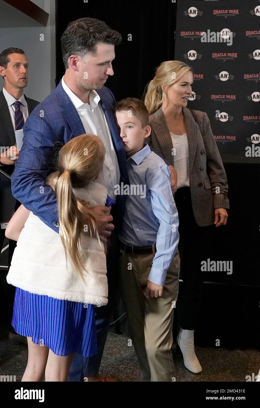 San Francisco Giants catcher Buster Posey hugs his children Addison and ...
