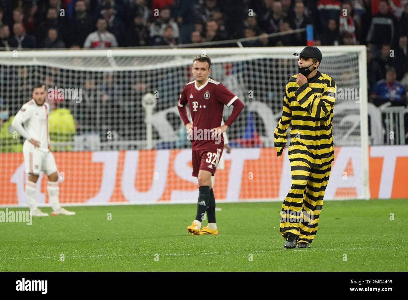 A pitch invader runs on the field during the Europa League Group A ...